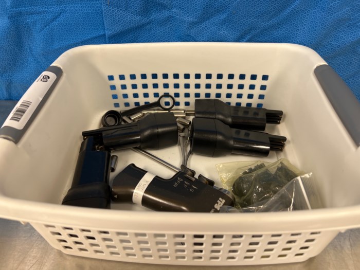 Bin filled with Stryker batteries, TPS Universal Driver and more for sale