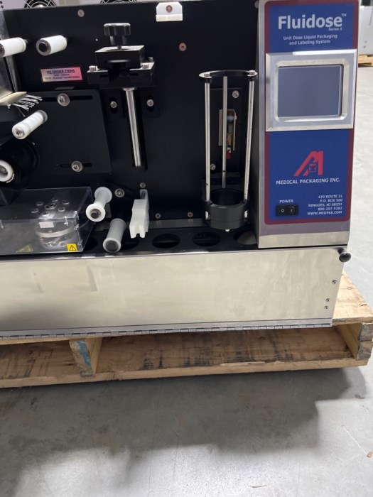 FLUIDOSE SERIES 5 UNIT DOSE LIQUID PACKAGING AND LABELING SYSTEM for sale